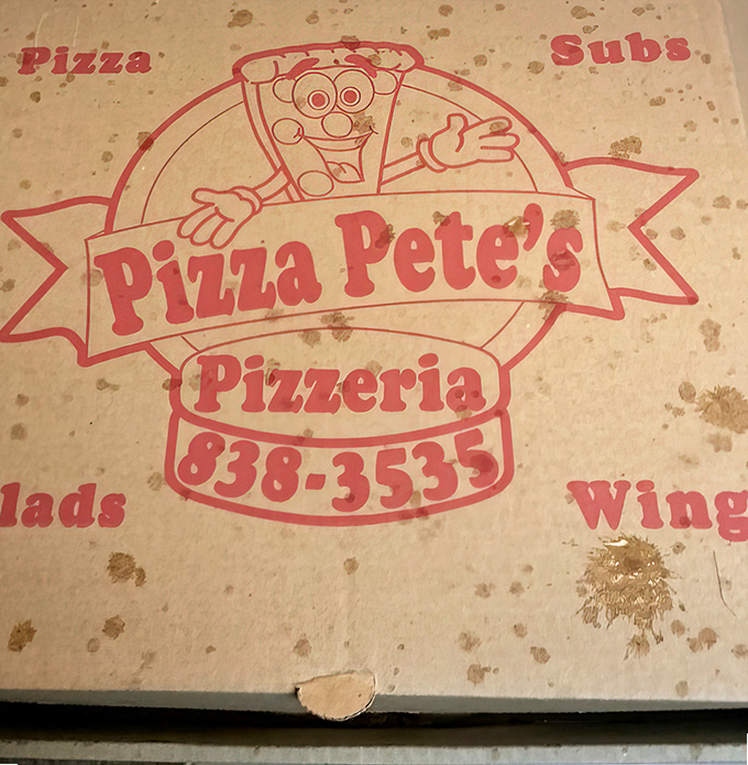 That box isn't just carrying pizza; it's delivering happiness with the cheerful Pizza Pete mascot promising good times ahead.