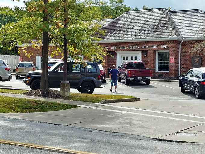The brick post office serves as both mail hub and impromptu community center, where locals exchange gossip faster than their Amazon packages. 