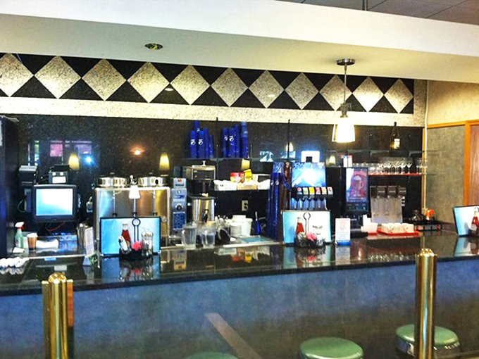 The command center where coffee dreams come true. That black and white diamond border isn't just decoration&mdash;it's a diner credential of authenticity.