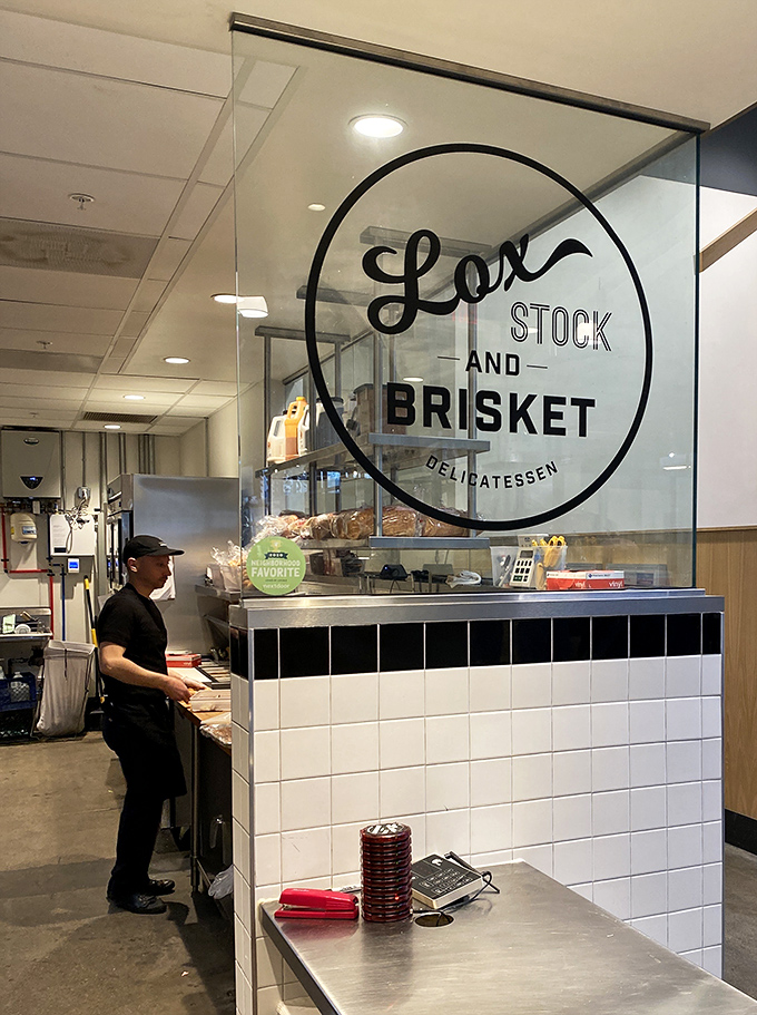 Behind the glass, sandwich artistry happens. Like watching a sculptor work, except this masterpiece will be devoured within minutes of completion.