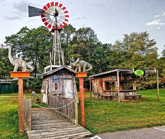 Rustic charm meets roadside whimsy with this windmill-topped outpost. Those dinosaurs on posts are clearly historical accuracy at its finest.