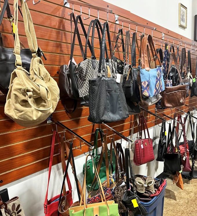 Handbag heaven on wooden display walls. From practical totes to statement clutches, these pre-loved purses prove style doesn't have to break the bank.
