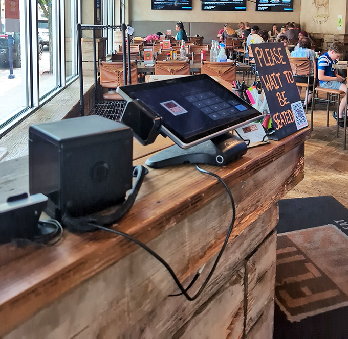 Modern ordering systems blend seamlessly with old-school hospitality for efficient, friendly service throughout.