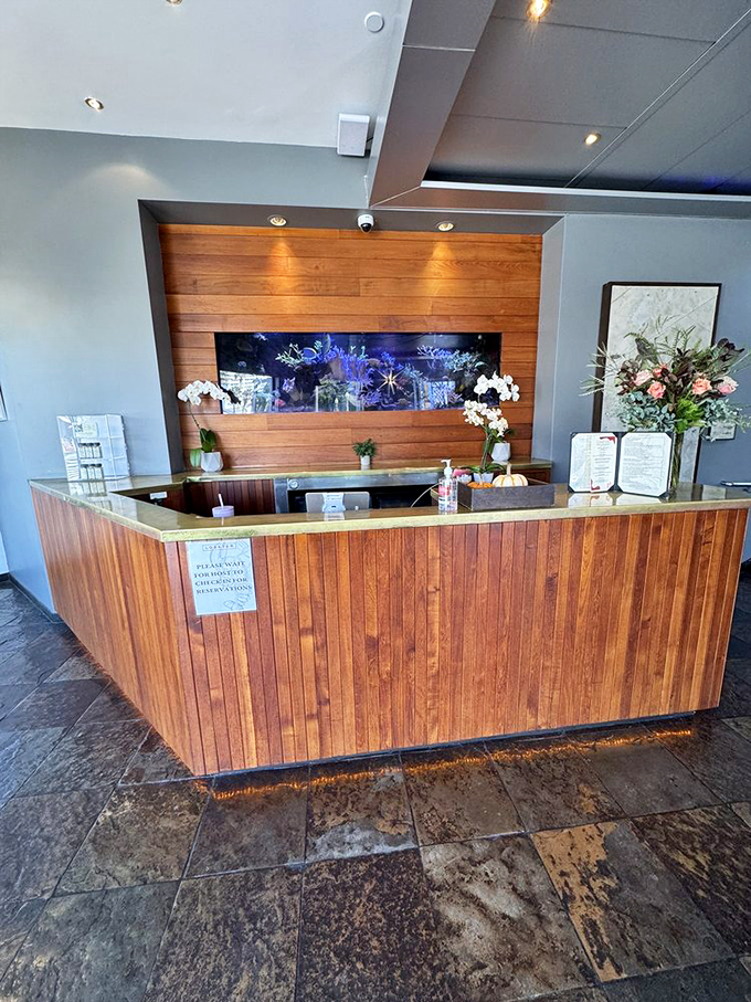 The reception desk – first checkpoint on your journey to seafood nirvana, where reservations are golden tickets and walk-ins cross their fingers.