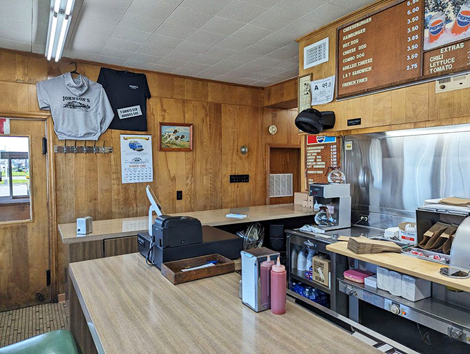 The command center where burger dreams become reality. Notice the absence of a "fancy food" button on that register.