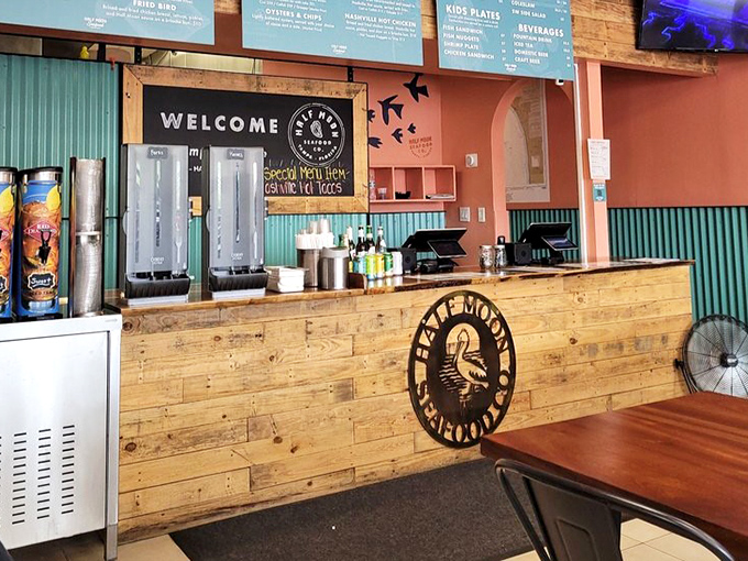 The counter where seafood magic happens. Notice the chalkboard promising daily specials that'll make you rethink your order.