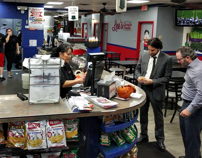 The moment of transaction – where money and hunger meet hope and satisfaction. Sandwich commerce at its most civilized.