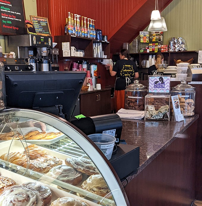 Behind the counter, where the magic happens. Like Willy Wonka's factory, but with more espresso and fewer questionable labor practices.