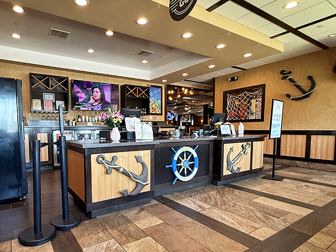 The host station adorned with anchors and ship wheels&mdash;nautical without crossing into "theme park" territory. A tasteful nod to the treasures from the deep.