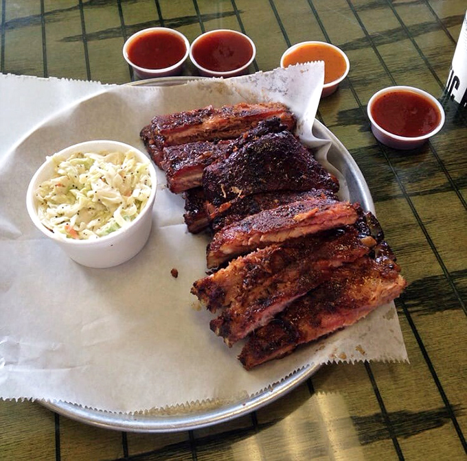 St. Louis ribs with competition-level bark and a perfect bite. The sauce cups aren't suggestions&mdash;they're flavor adventures waiting to happen.
