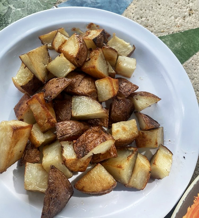 Potato perfection in every bite. These golden-brown home fries are the supporting actors that steal the breakfast show.