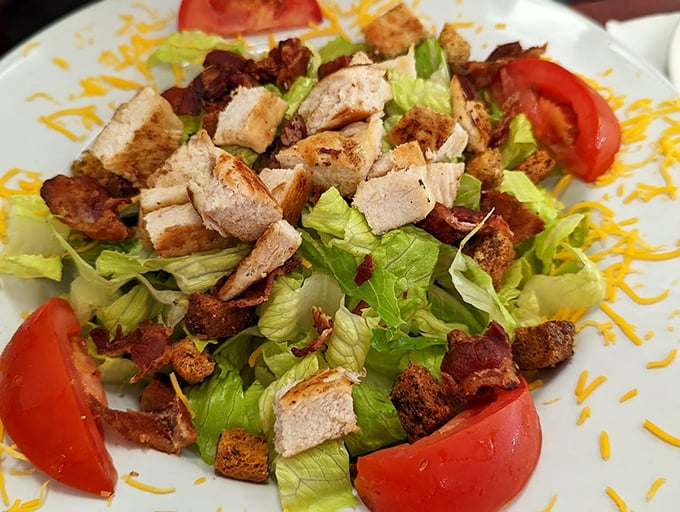 A salad that doesn't apologize for being delicious. Crisp lettuce, grilled chicken, and bacon that reminds you vegetables are just delivery vehicles for the good stuff.