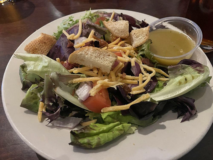 A salad that doesn't apologize for being healthy&mdash;crisp greens, shredded cheese, and homemade dressing that makes eating vegetables feel like cheating.