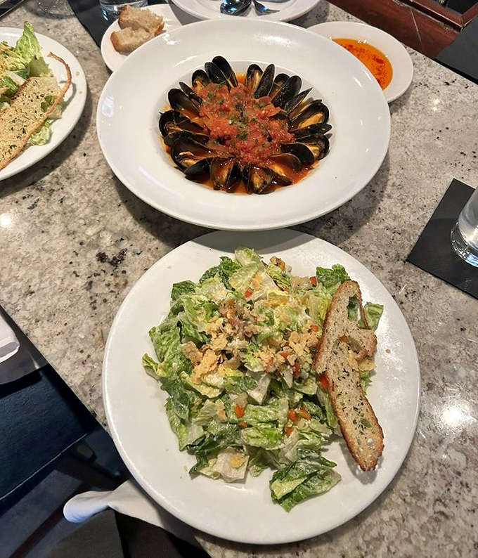 When mussels and Caesar salad share a table, beautiful friendships and satisfied stomachs inevitably follow.