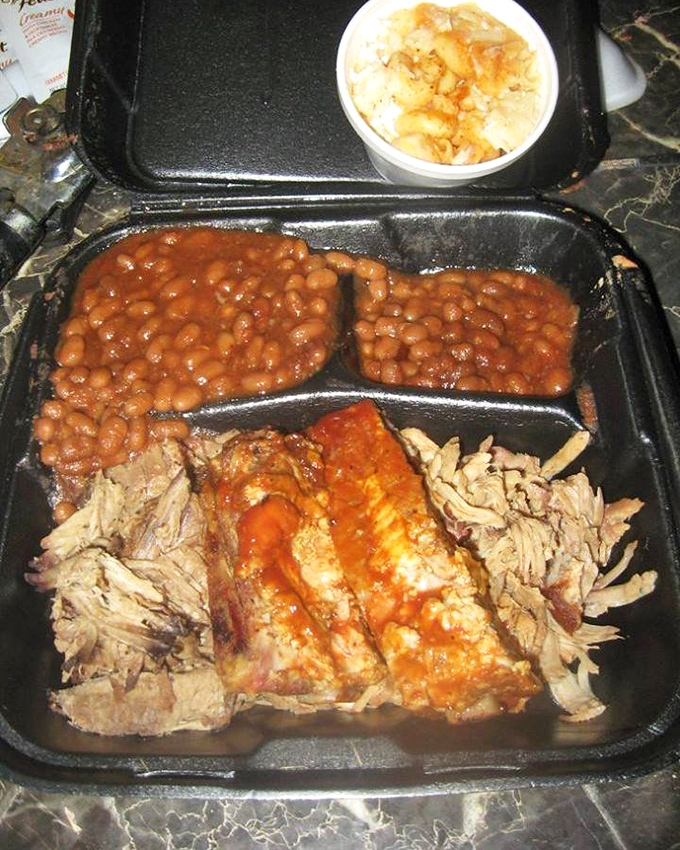 When you can't decide on one BBQ specialty, the universe provides this sampler with cornbread that deserves its own fan club.