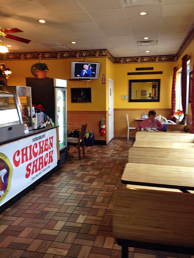 Brick floors and wood-paneled walls create an atmosphere of timeless comfort. This isn't just eating – it's experiencing a slice of Americana.