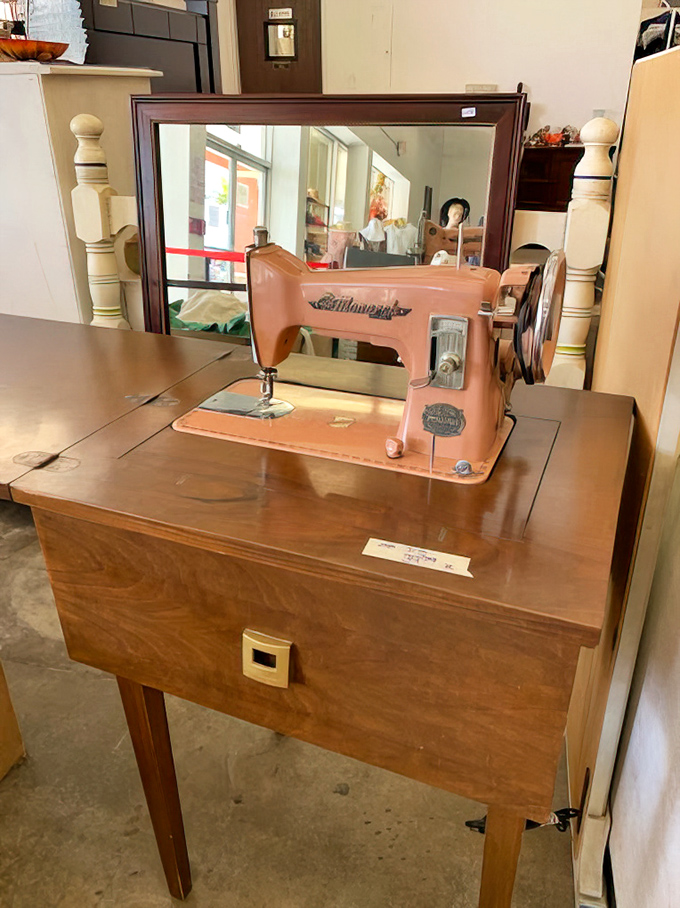 This pink Kenmore sewing machine perched atop its wooden throne isn't just vintage&mdash;it's a mechanical time capsule of handmade history.