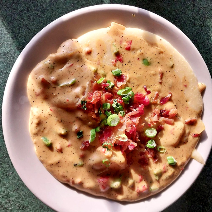 This isn't just shrimp and grits &ndash; it's a creamy Southern hug in a bowl, topped with bacon confetti because someone loves you.