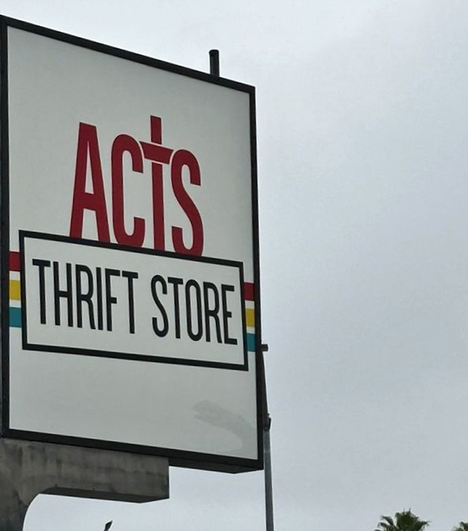 The classic ACTS logo stands tall against California skies, a beacon for bargain hunters and sustainability champions alike.