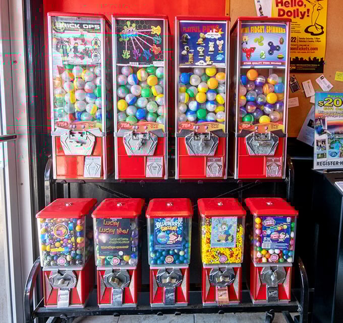 Colorful gumball machines standing at attention like sweet sentinels. Proof that sometimes the best dessert comes with a satisfying twist and turn.