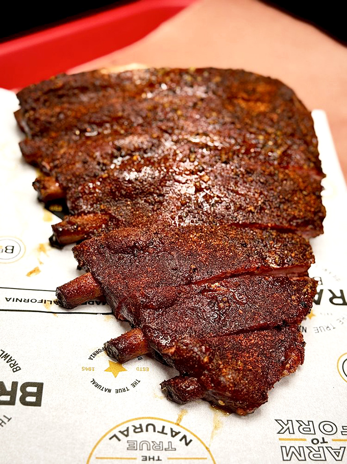 A rack of ribs with a bark so perfect it belongs in a barbecue botanical garden. Carnivore eye candy at its finest.