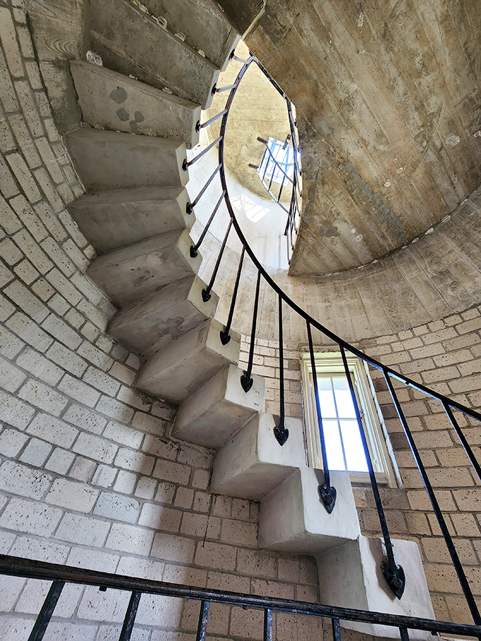 These spiral stairs have carried thousands of eager climbers, each step worn smooth by visitors seeking that perfect view waiting at the top.