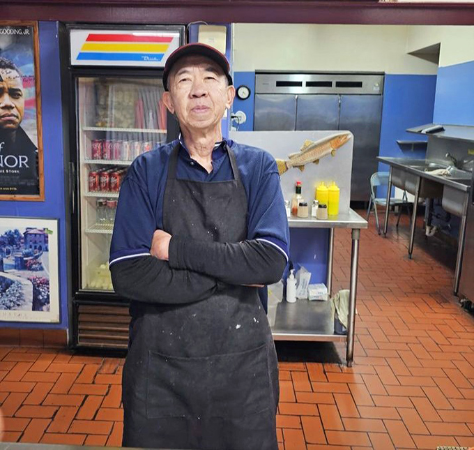 Behind every great fish and chips is someone who's mastered the art of perfect frying. The wizard behind the curtain of steam.