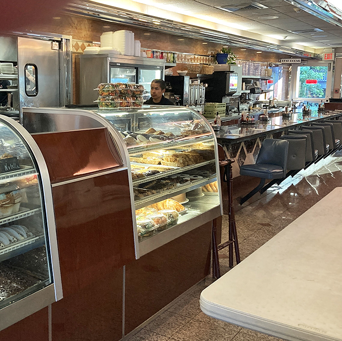 Behind the dessert case, where dreams are displayed under glass and willpower goes to die. Choose wisely&mdash;or don't choose at all.