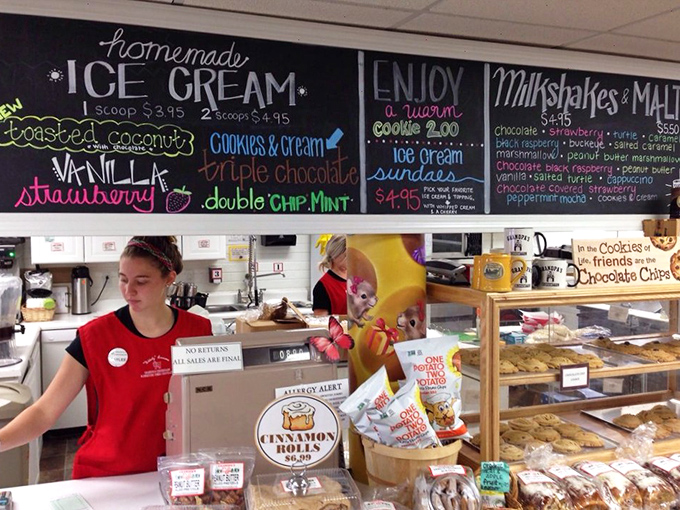 Behind every great ice cream shop is someone in a red shirt making magic happen. The chalkboard menu is just a list of happiness delivery systems.