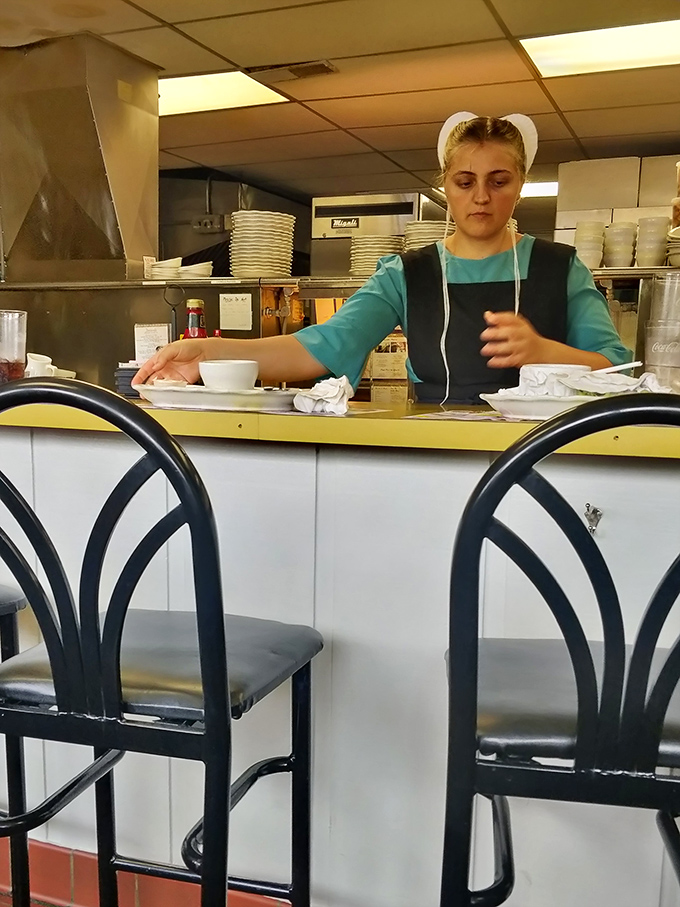 The staff works with quiet efficiency, their traditional dress a reminder that some culinary traditions are worth preserving exactly as they are.