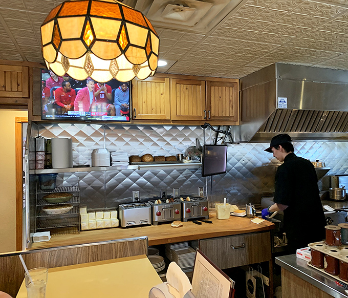 
The collection of bobbleheads and sports memorabilia showcases Wisconsin pride that's as authentic as the cheese in their butter burgers. 