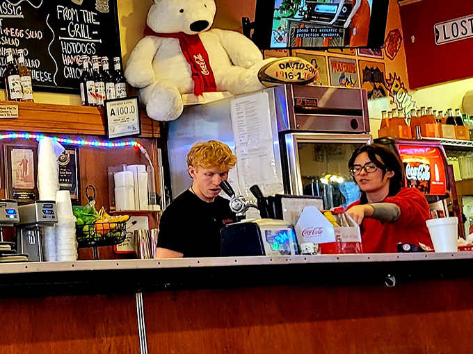 Behind the counter, the real magic happens. Young staff carrying on traditions that began before their parents were born.