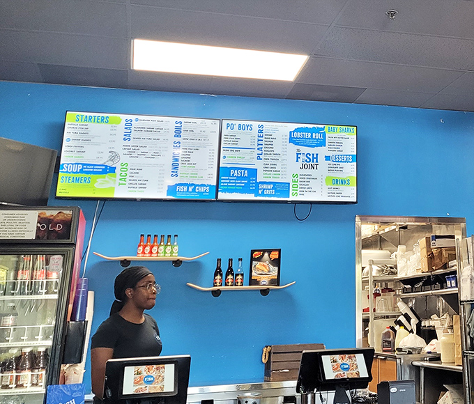 Behind every great seafood joint is a team that knows their mahi from their grouper. The blue walls match their dedication to ocean-fresh quality.