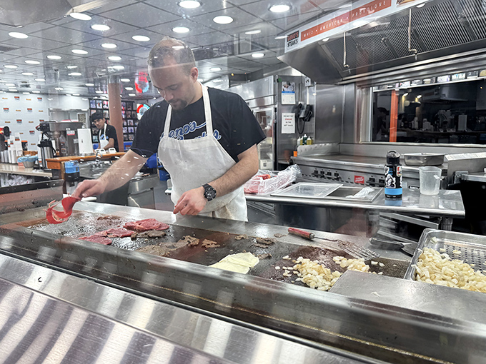 The maestros of meat, working their magic on the grill. Their hands move with the confidence of true artisans.
