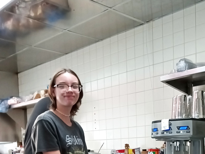 The smiles here are as genuine as the food is delicious. That milkshake looks like it's about to steal the scene from its already photogenic company.