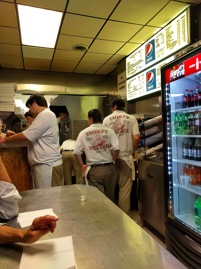 The kitchen crew, wearing their Fiori's uniforms like badges of honor, orchestrating the symphony of dough and cheese that keeps Pittsburgh fed.