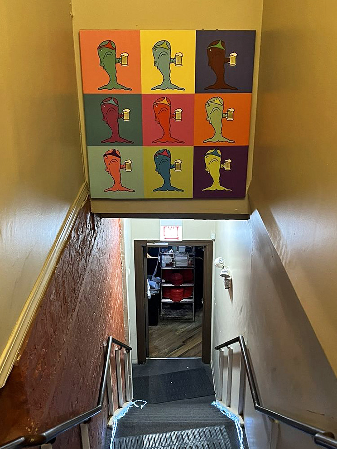 The staircase leading to pizza nirvana, complete with Warhol-esque whale art that nods to the restaurant's literary namesake.