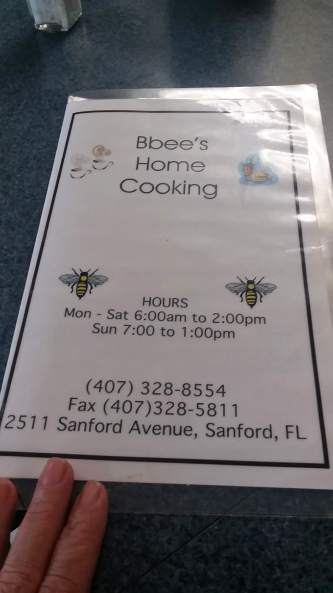 The menu cover reveals the buzz-worthy details &ndash; early bird hours ensure you'll never miss your morning French toast fix at this Sanford gem.