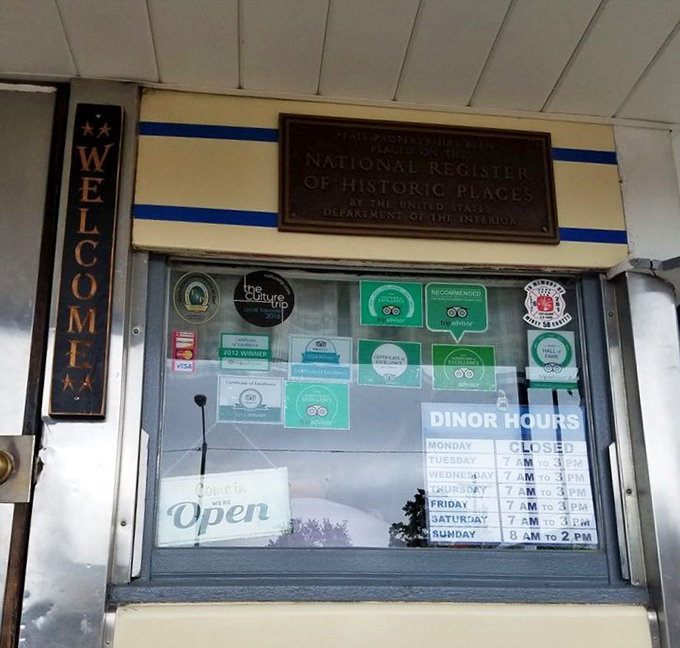 That National Register plaque isn't just decoration—it's confirmation that breakfast served all day is indeed historically significant. Hours posted for your planning pleasure.