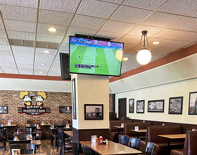 Even with sports on the TV, the real spectator sport at TooJay's is watching towering sandwiches make their way to neighboring tables.