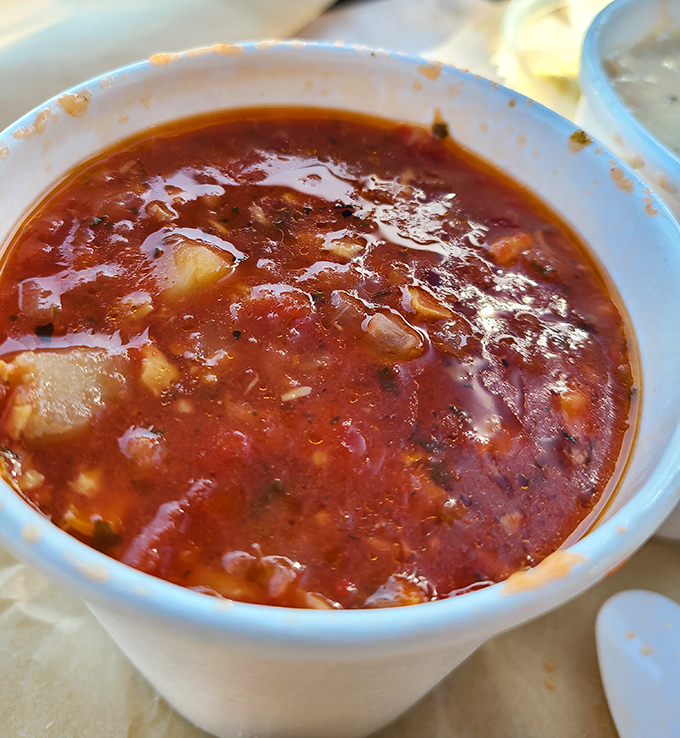 The Manhattan-style red chowder that divides families but conquers taste buds. Tomato-based rebellion in a humble paper cup.