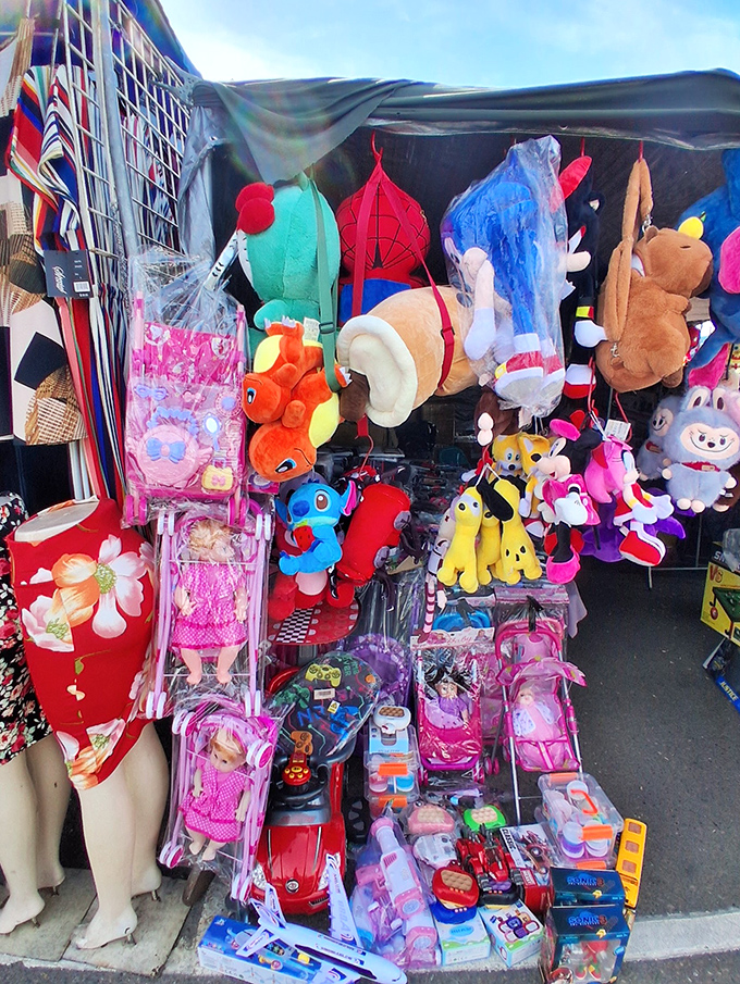 A toy wonderland where stuffed animals and action figures dangle like colorful fruit, ripe for the picking by delighted little hands.