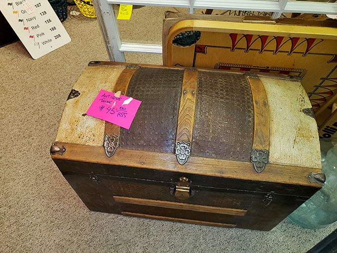 This isn't just a trunk; it's a mystery box that once carried someone's worldly possessions across oceans or continents.
