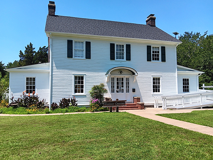 The visitor center's colonial charm welcomes travelers like an old friend, promising stories and secrets of the surrounding wilderness.