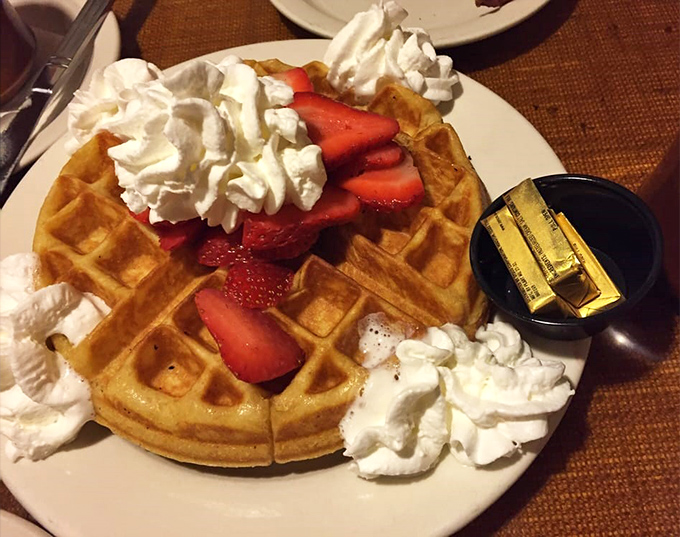 This waffle wears its strawberries and whipped cream like jewelry. Breakfast bling that's worth every delicious bite.