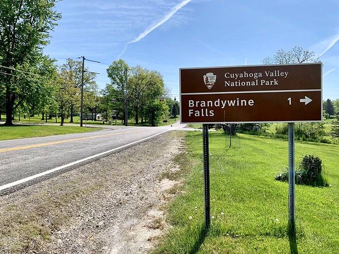 One mile to natural wonder! This sign doesn't just point the way&mdash;it promises an experience worth every step of the journey.
