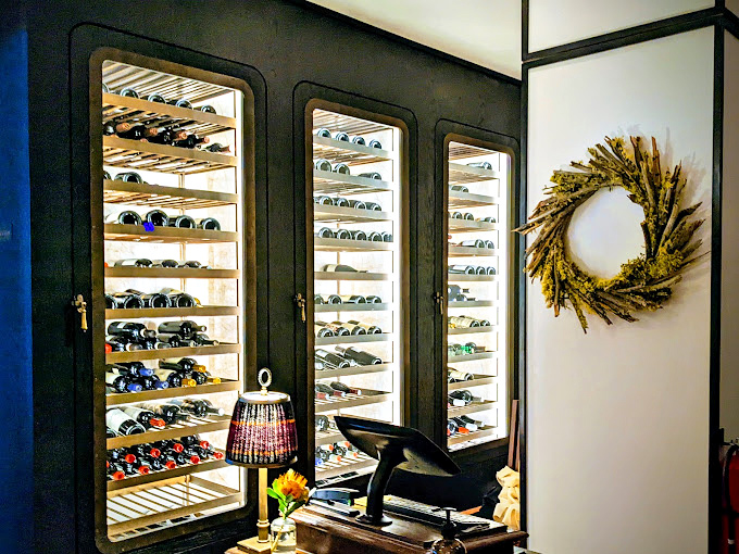 A wine collection that would make Bacchus himself pause mid-sip. These temperature-controlled cabinets aren't storage—they're shrines to fermented grapes.