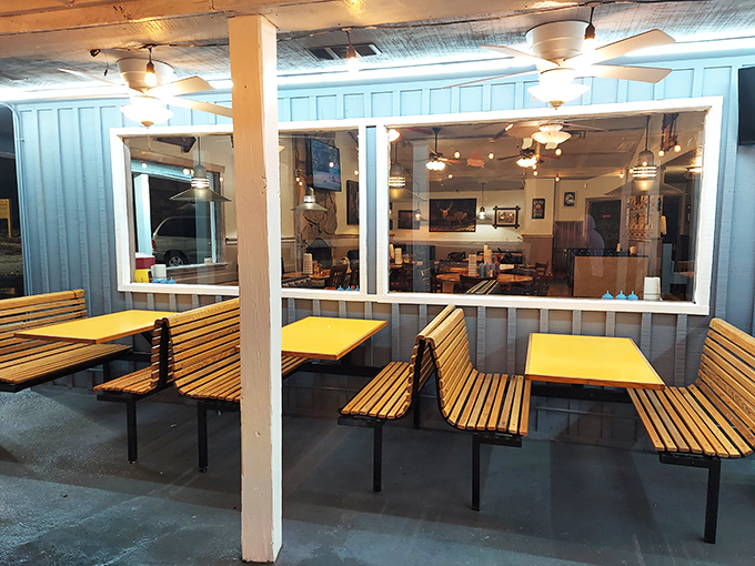 Outdoor seating where the breeze carries whispers of wood smoke and contentment.