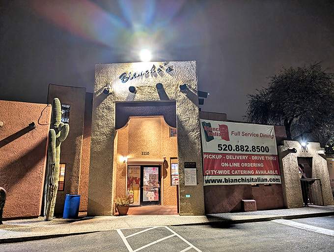Bianchi's adobe-style building glows with warmth at night, much like the perfectly melted cheese on their legendary pies.
