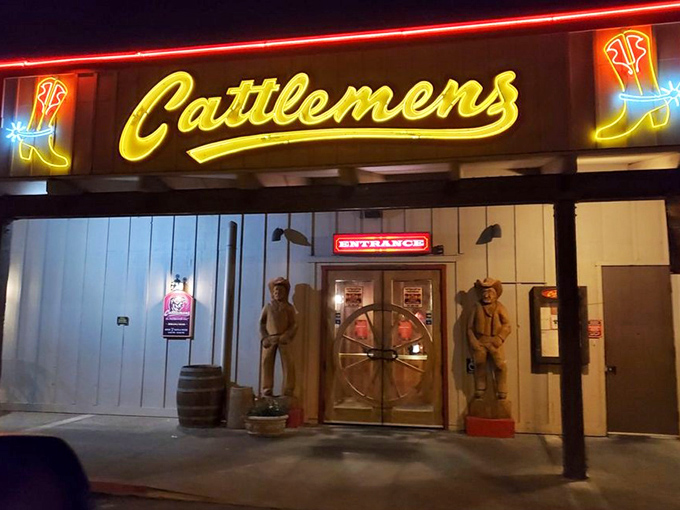 Those wooden cowboys standing guard promise authentic Western dining where every steak is seasoned with frontier spirit and genuine hospitality.